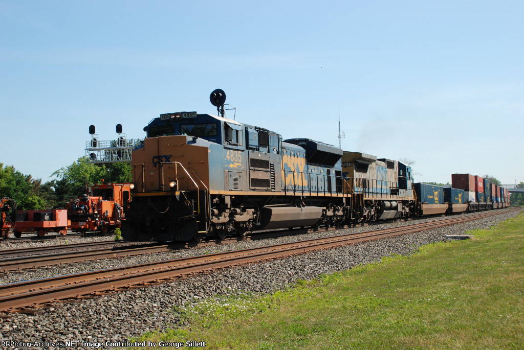 CSX 4835 throttles up with a heavy intermodel train in tow.